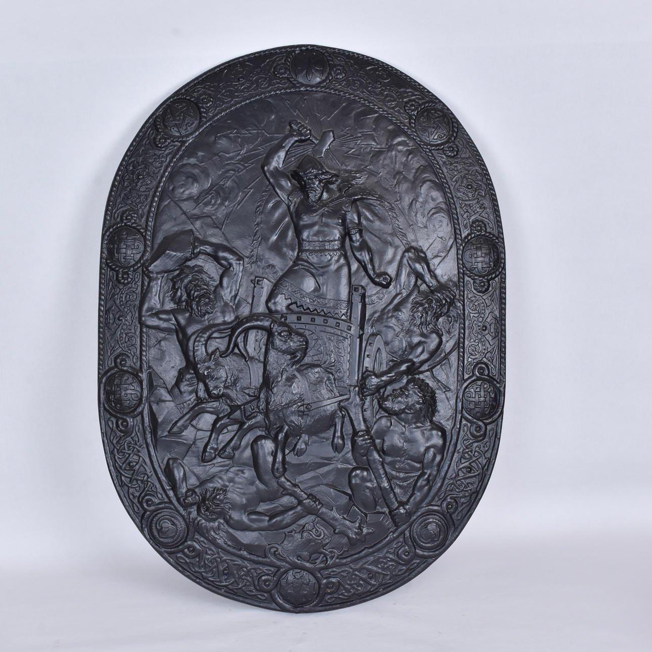 A shield, painted cast iron, Husqvarna, 20th century, Thor's fight ...