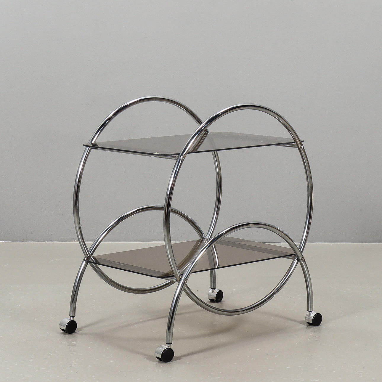 A serving trolley, chromed steel tubes and glass plates, Ikea, second ...