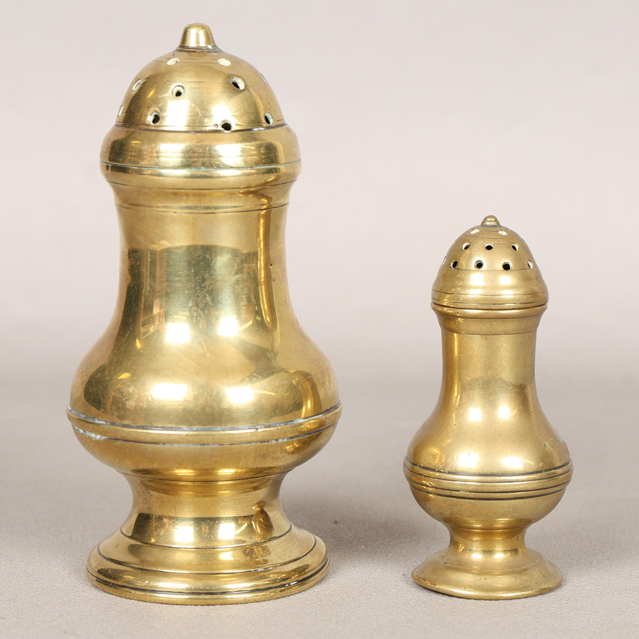 TWO GEORGE III BRASS CASTORS, CIRCA 1780-1800 (2). Silver & Metals ...