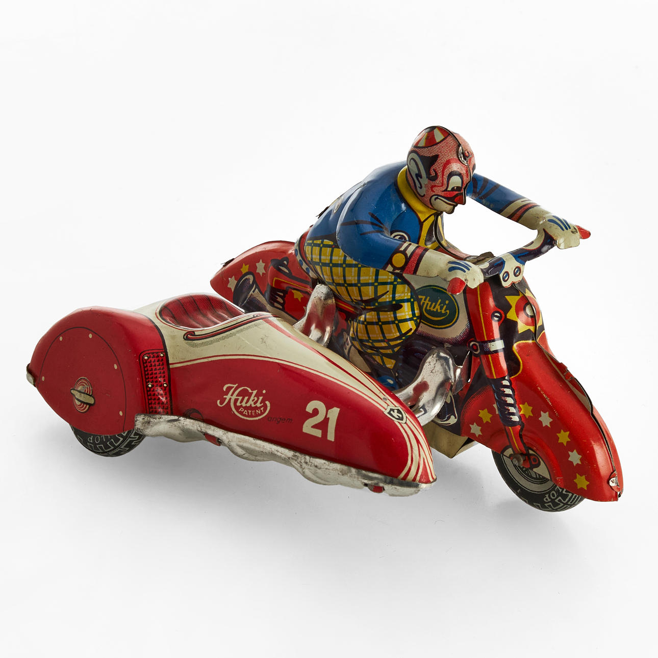 HUKI. Clown on motorcycle with sidecar, lithographed sheet, friction ...