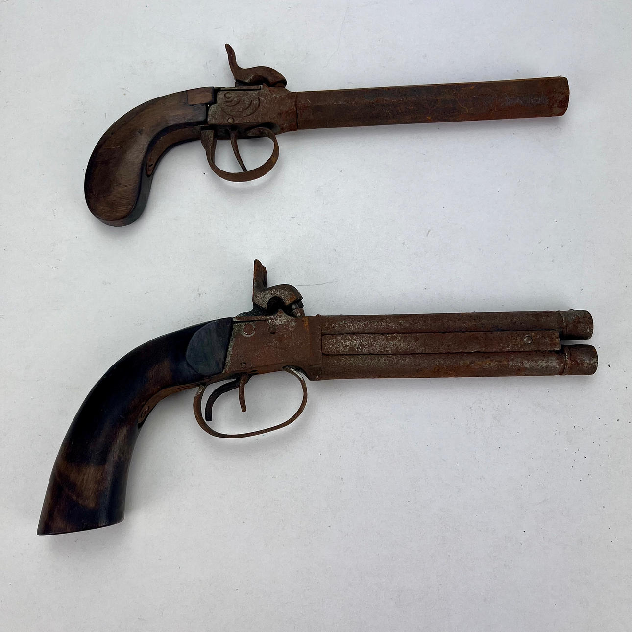 A set of two double-barreled lock pistols, 19th century. Weapons ...