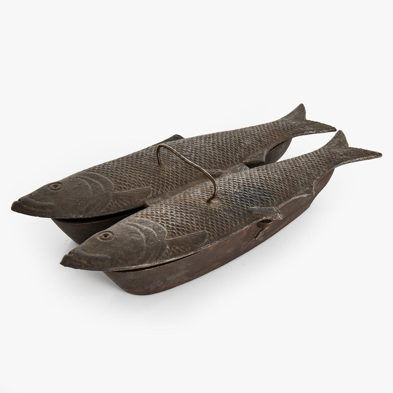 A cast iron herring grate with double fish moulds, probably Skoglund ...