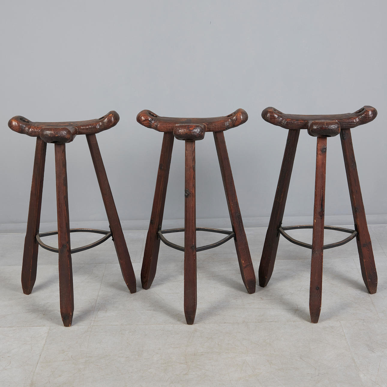 IN THE MANNER OF SERGIO RODRIGUES. Three brutalist stool/bar stools ...