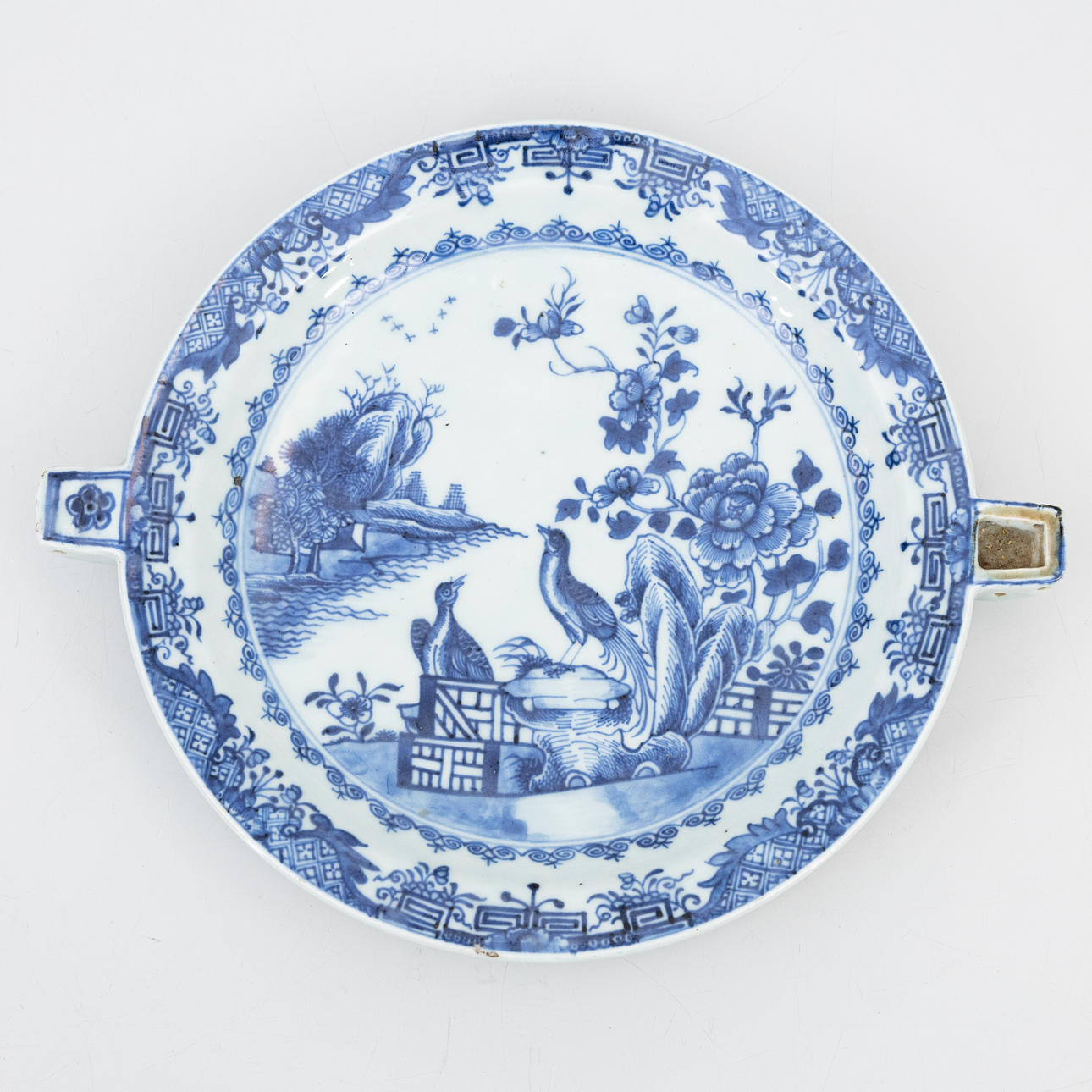 A porcelain heating plate, China, Qianlong 1736-1795. Asiatica ...