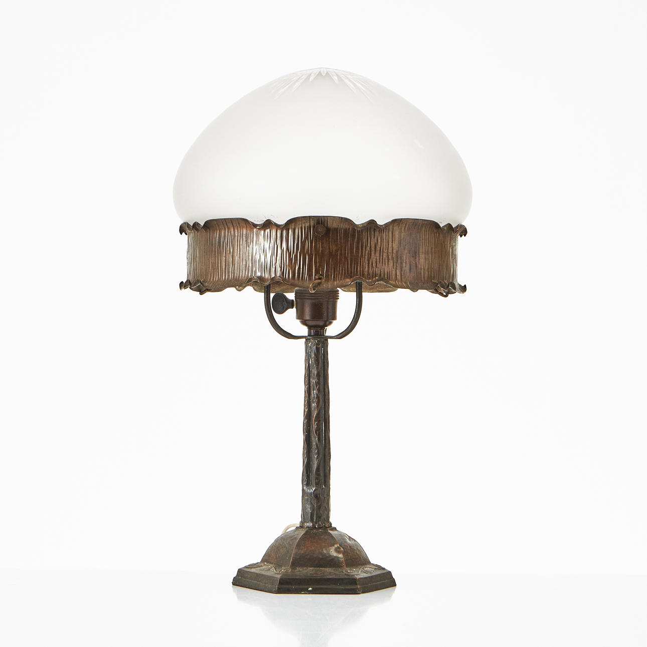 A table lamp, early 20th century, Art Nouveau, hammered copper, glass ...