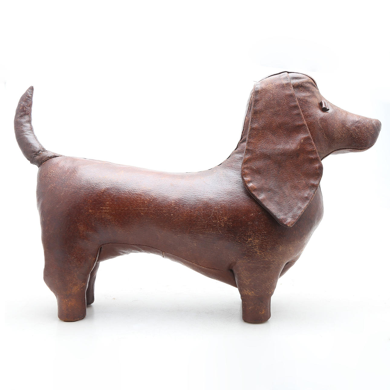 ATTRIBUTED TO DIMITRI OMERSA. Dachshund-shaped footrest. Furniture ...