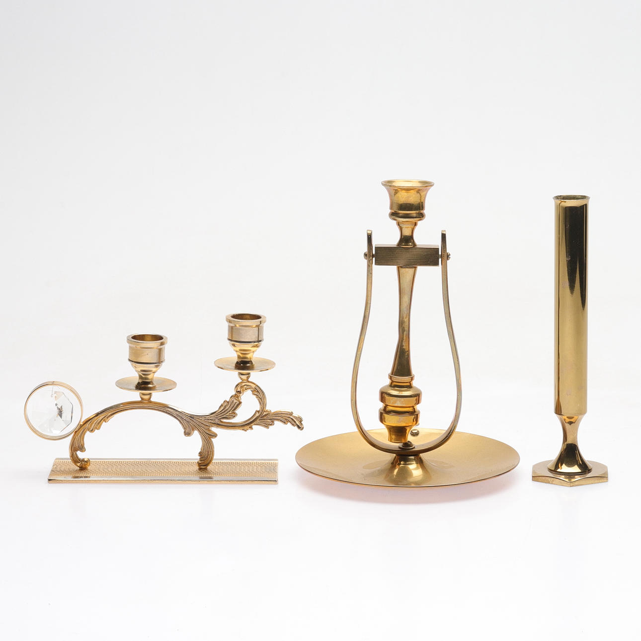 A set of three brass candlesticks, including Skultuna, 20th century ...