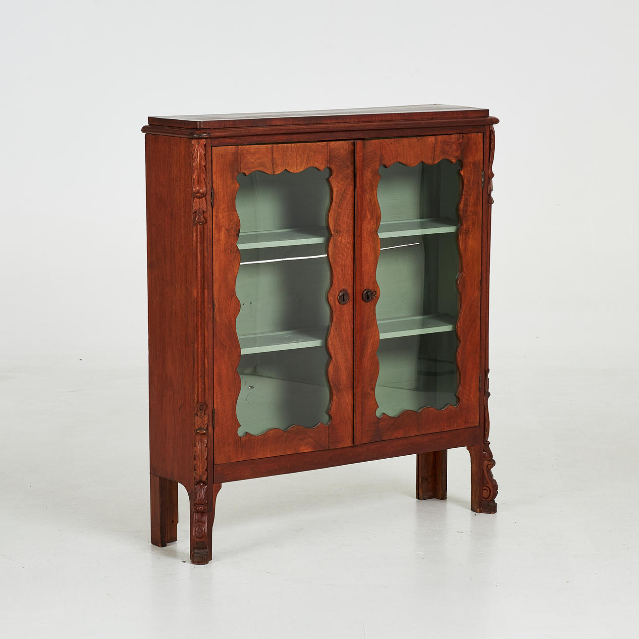 BOKSKÅP. Later part of the 19th century, cut decoration, contoured ...