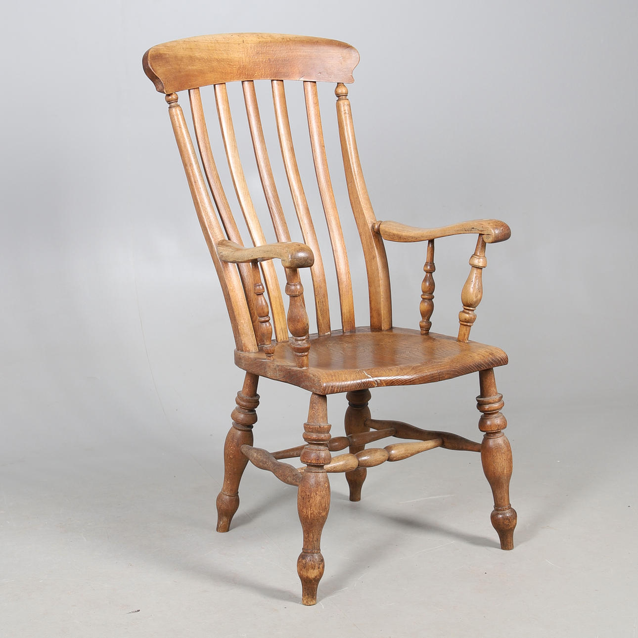 A PINE STICK BACK ARM CHAIR. Furniture - Armchairs & Chairs - Auctionet
