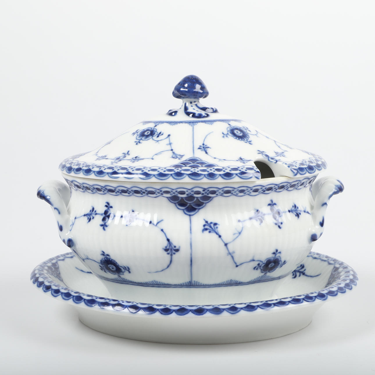 A “Musselmalet” porcelain dish on a platter, Royal Copenhagen, Denmark ...