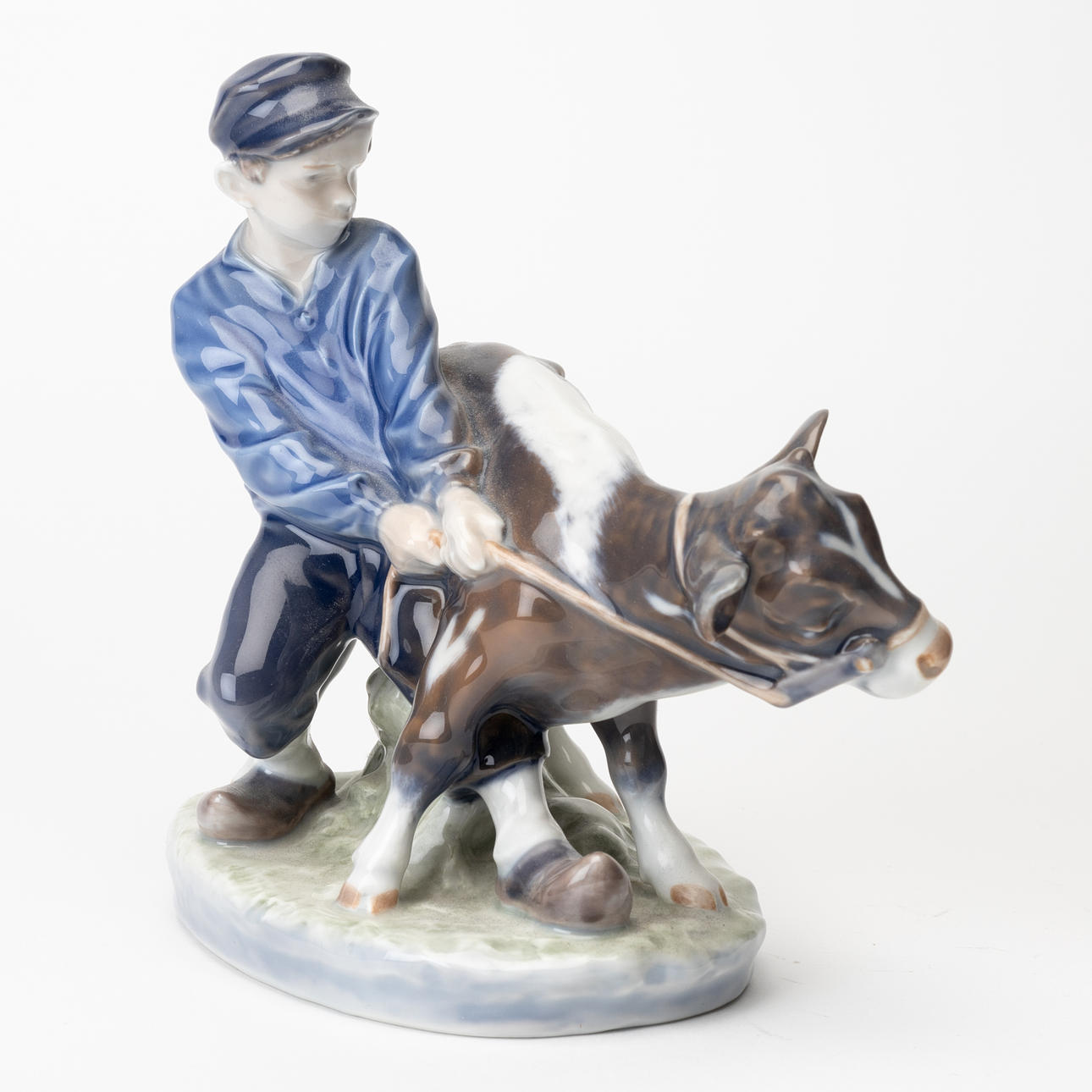 A porcelain figurine, Boy with calf, Royal Copenhagen, Denmark ...