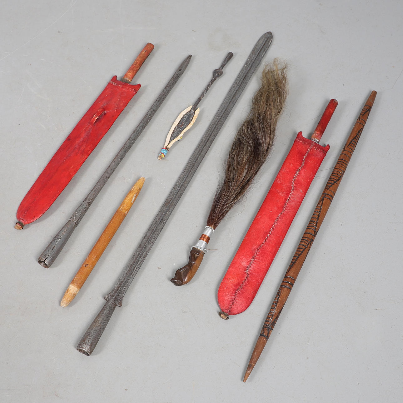 A COLLECTION OF AFRICAN EDGED WEAPONS AND OTHER ITEMS. Weapons ...