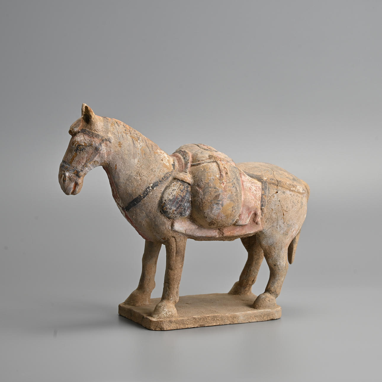 A RARE CHINESE PAINTED POTTERY PACK HORSE, NORTHERN WEI DYNASTY ...