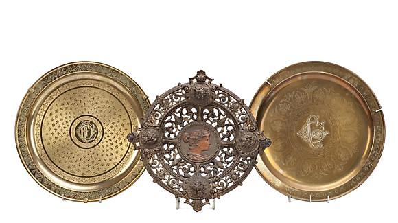 Three ornamental dishes in brass and calamine, early 20th Century ...