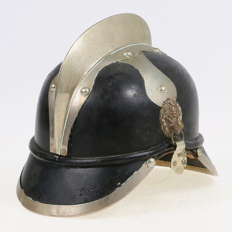 FIRE HELMET, 1900s. Weapons & Militaria - Armour & Uniform - Auctionet