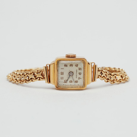 BRACELET WATCH, 18k gold in case and link, manual. Total weight about ...