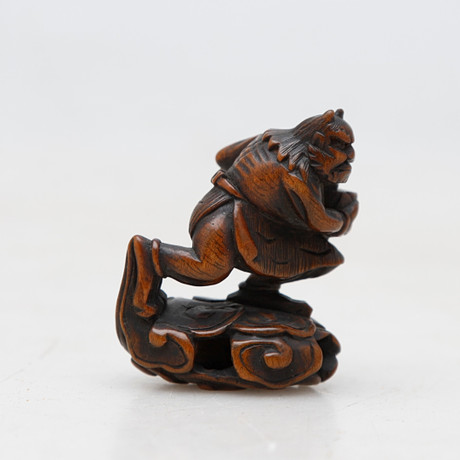 JAPANESE SCHOOL FROM THE EDO PERIOD, 19TH CENTURY. Oni carrying a relic ...