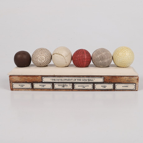 SCULPTURE, golf balls, wood/stone mass, 1900/2000s. Ceramics ...