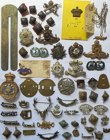 A COLLECTION OF MILITARY CAP BADGES AND SIMILAR INSIGNIA. Weapons ...