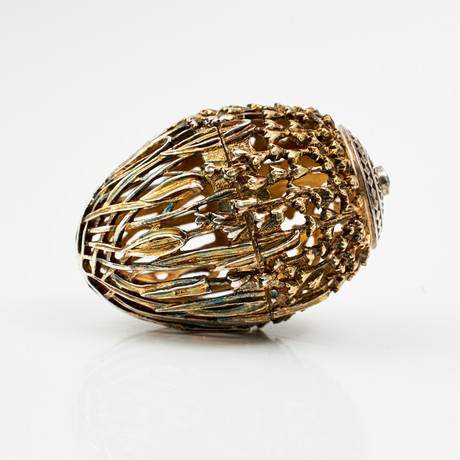 ROBERT GLOVER, openwork and openable egg with floral decoration, partly ...