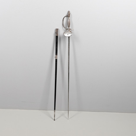 A 19TH CENTURY POLISHED STEEL COURT SWORD AND SCABBARD. Weapons ...