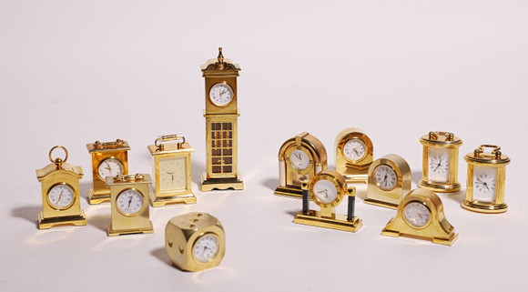 COLLECTION OF 13 SHOWCASE CLOCKS IN GOLDEN METAL. Clocks & Watches ...