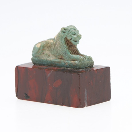 AN EGYPTIAN TURQUOISE GLAZED FAIENCE MODEL OF A LION. Ceramics ...