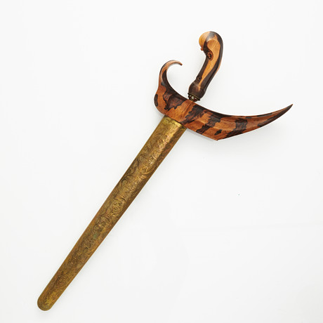 KRIS, keris, circa 1900, wavy, damasked blade, brass sheath with ...