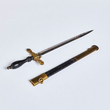 STICKERT, Fleet, brass, with rolling pin in black painted wood, sheath ...