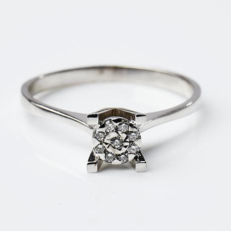 RING, 8k white gold, and 9 small diamonds in the shape of a flower ...