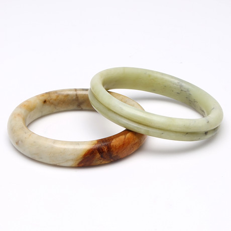 BRACELETS, BANGLES, 2 pieces, China, 20th century, jade or jade-like ...