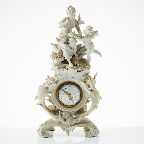 TABLE CLOCK, bisque porcelain, circa 1900, decoration in the form of a ...
