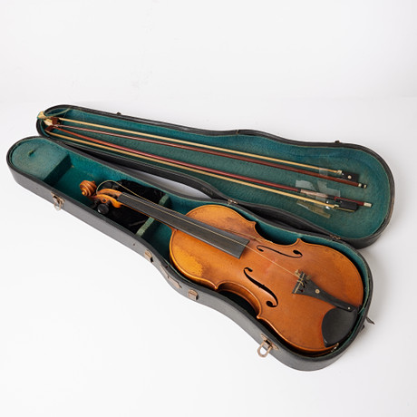 VIOLIN, inside marked "E. Kleven 1917", with two strings, one of which ...