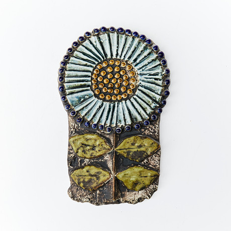 LISA LARSON. Wall plaque, with sunflower motif, glazed stoneware ...