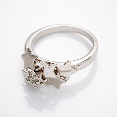 RING, 18k white gold, decoration with stars and small diamonds, stars ...