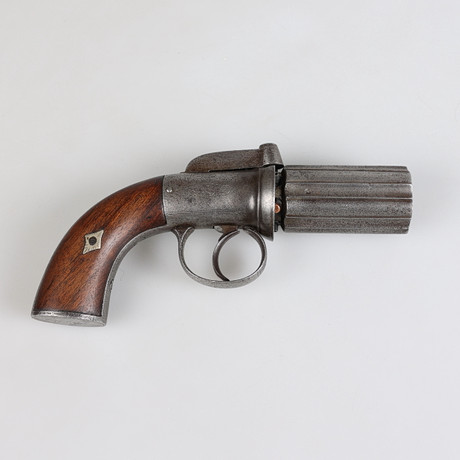BUCKLE PISTOL, Pepperbox 6-barrel revolver of British type with ...