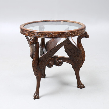 COFFEE TABLE, round shape, oak frame with carved decoration of mythical ...