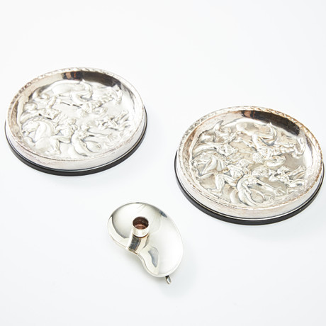 COASTERS, two pieces, silver in relief on bakelite, and MINIATURE ...