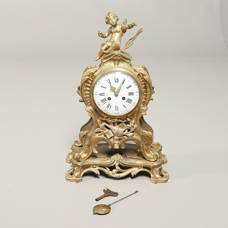 A FRENCH ROCOCO STYLE GILT METAL TABLE CLOCK. Clocks & Watches - Table ...