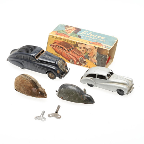 A SHUCO TINPLATE CLOCKWORK CAR, ANOTHER CLOCKWORK CAR AND TWO CLOCKWORK ...