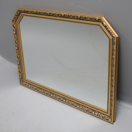 A REPRODUCTION HEXAGONAL MOULDED GILT FRAME WALL MIRROR. Mirrors ...