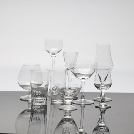 GLASSWARE, 71 parts, various models & manufacturers, 1900s. Glass ...