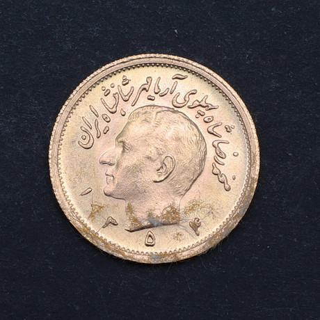 AN IRANIAN 1 PAHLAVI GOLD COIN. Coins, Medals & Stamps - Coins - Auctionet