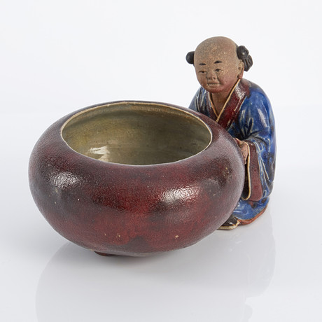 BOWL, Shiwan, China, early 20th century, in the form of a boy holding a ...
