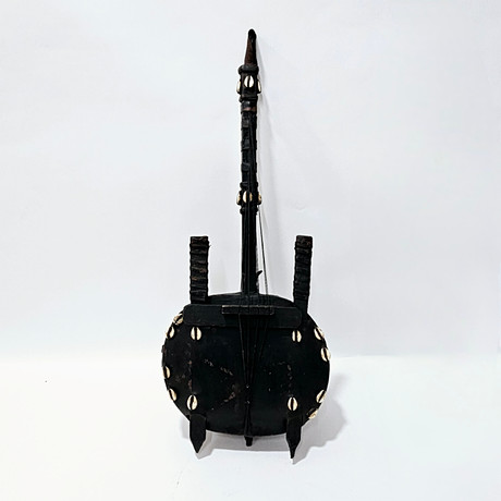 N'GONI. AFRICAN INSTRUMENT IN LEATHER AND EBONIZED WOOD. Tribal art ...