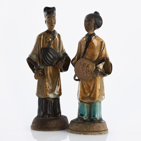 FIGURINES, a pair, China, late 19th century, Shiwan, in the form of a ...