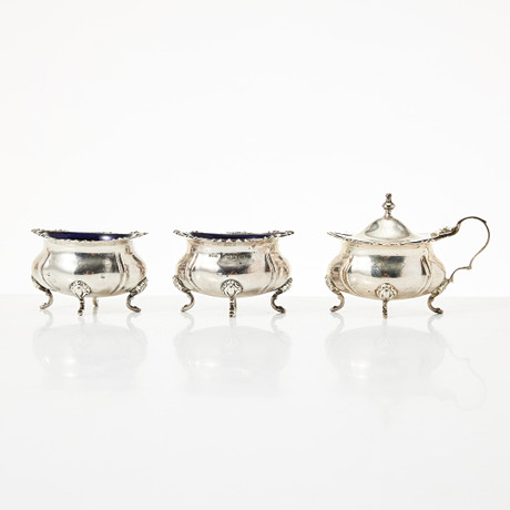 A pair of SALT POTS and a MUSTARD POT, sterling silver, rococo style ...