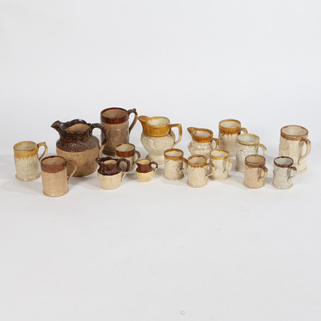 A COLLECTION OF 19TH CENTURY POTTERY MUGS, VARIOUS DESIGNS WITH TREACLE ...