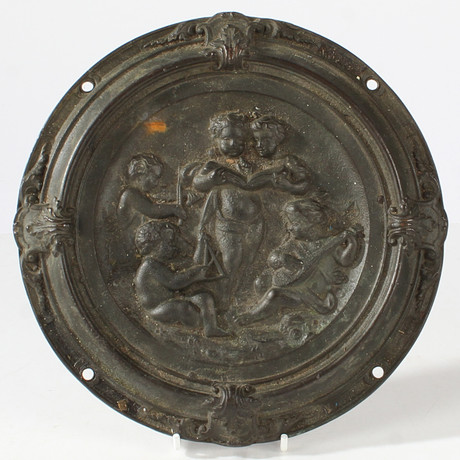 A 19TH CENTURY BRONZE PLAQUE DEPICTING PUTTI PLAYING MUSICAL ...