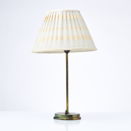 TABLE LAMP. Mid-20th century, brass, textile-covered lampshade ...